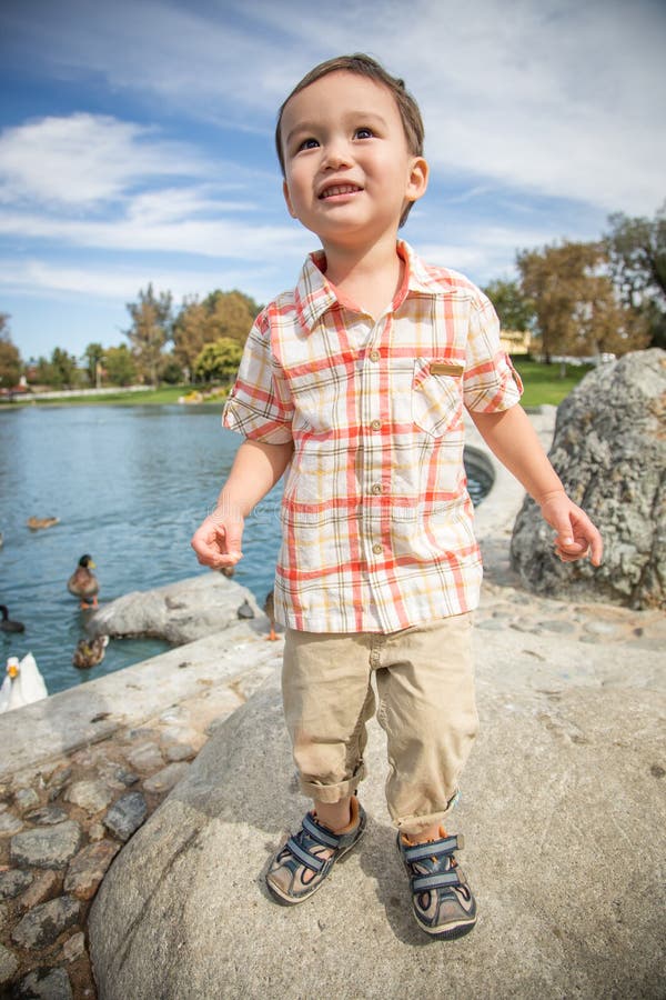 Young Chinese and Caucasian Boy Having Fun at the Park and Duck Pond ...