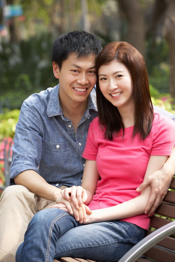 Young Chinese Couple Relaxing in Park Together Stock Photo - Image of ...