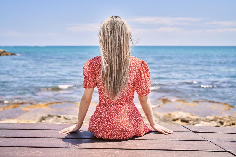 Young Chinese Girl on Back View Sitting on the Bench at the Beach Stock ...