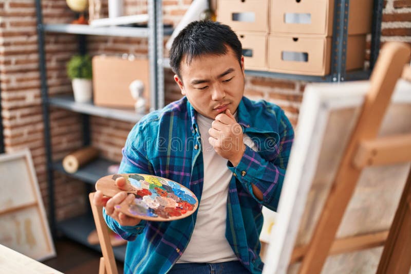Young Chinese Man Artist Drawing on Canvas at Art Studio Stock Photo ...