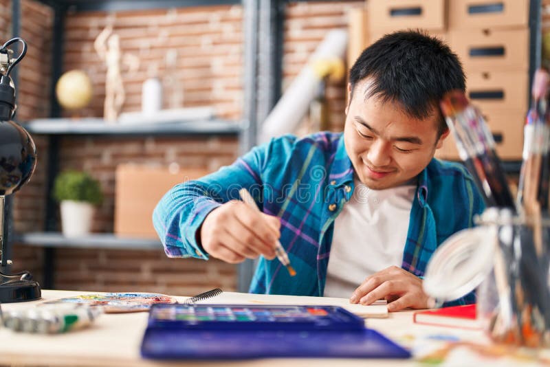Young Chinese Man Artist Drawing on Notebook at Art Studio Stock Image ...