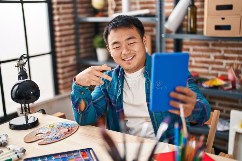 Young Chinese Man Artist Having Video Call at Art Studio Stock Image ...