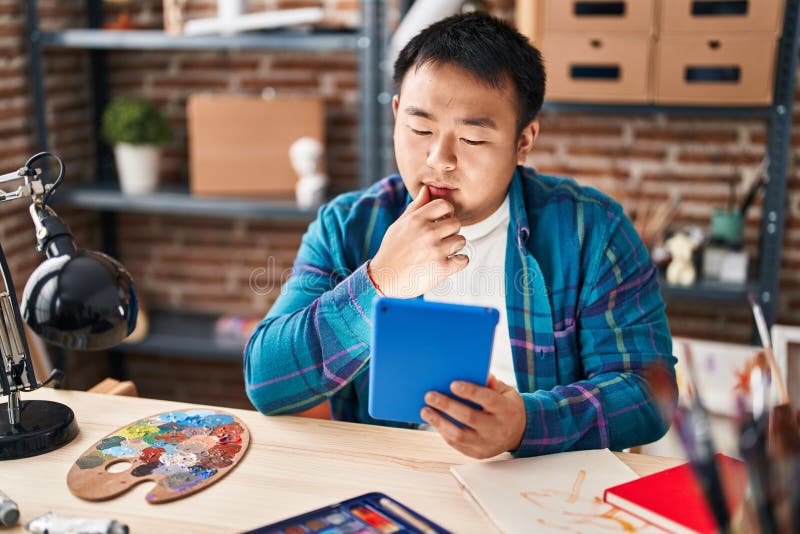 Young Chinese Man Artist Using Touchpad at Art Studio Stock Image ...