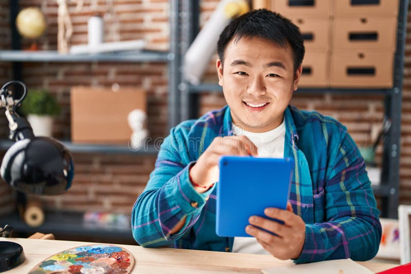 Young Chinese Man Artist Using Touchpad at Art Studio Stock Photo ...