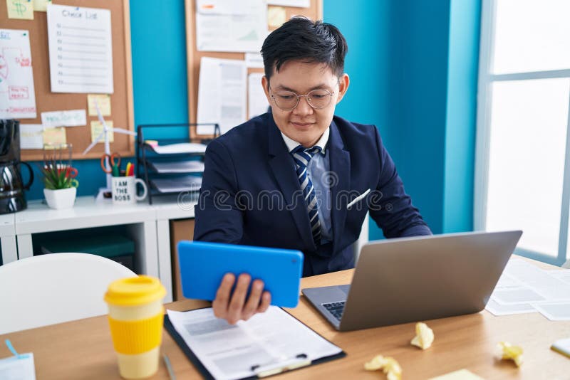 Young Chinese Man Business Worker Using Touchpad and Laptop at Office ...