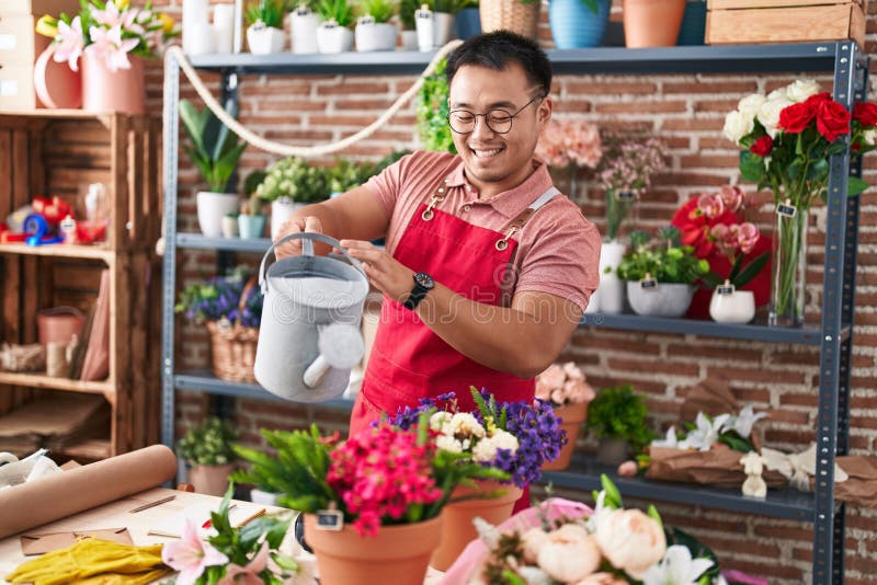 Young Chinese Man Florist Watering Plant at Florist Stock Image - Image ...