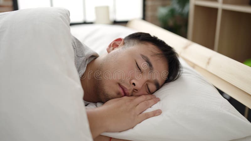 Young Chinese Man Lying on Bed Sleeping at Bedroom Stock Image - Image ...