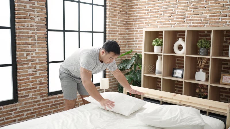 Young Chinese Man Make Bed at Bedroom Stock Photo - Image of pajamas ...