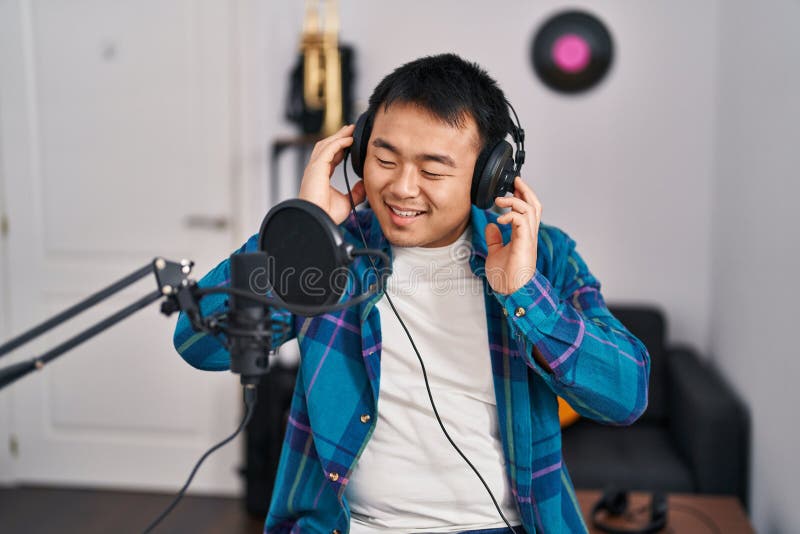 Young Chinese Man Singer Singing Song at Music Studio Stock Photo ...