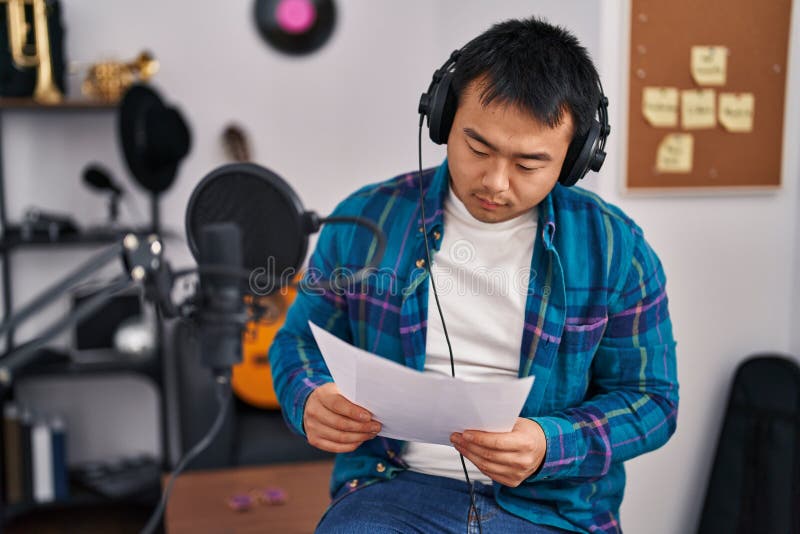 Young Chinese Man Singer Singing Song at Music Studio Stock Photo ...