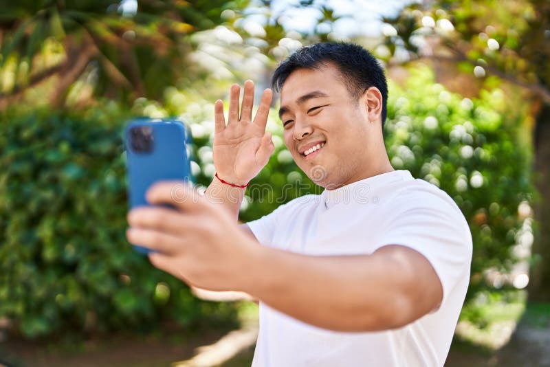 Young Chinese Man Smiling Confident Having Video Call at Park Stock ...