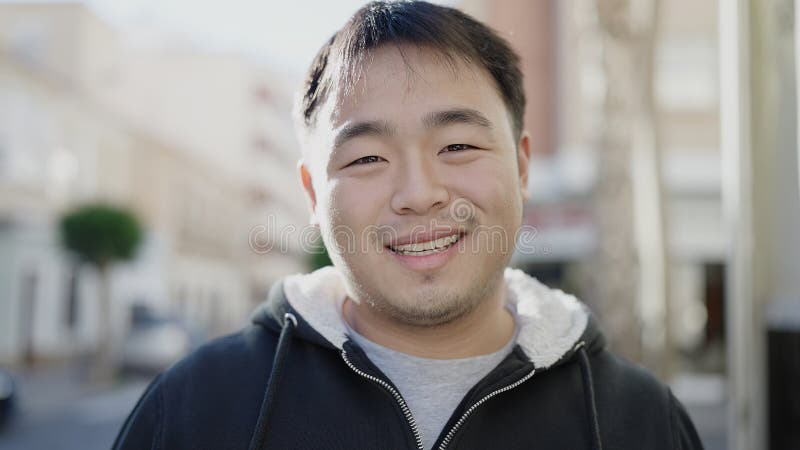 Young Chinese Man Smiling Confident Standing at Street Stock Image ...