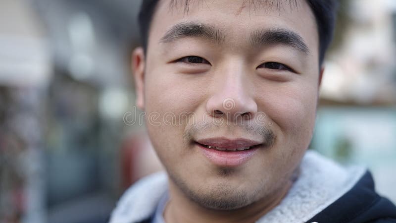 Young Chinese Man Smiling Confident Standing at Street Stock Photo ...