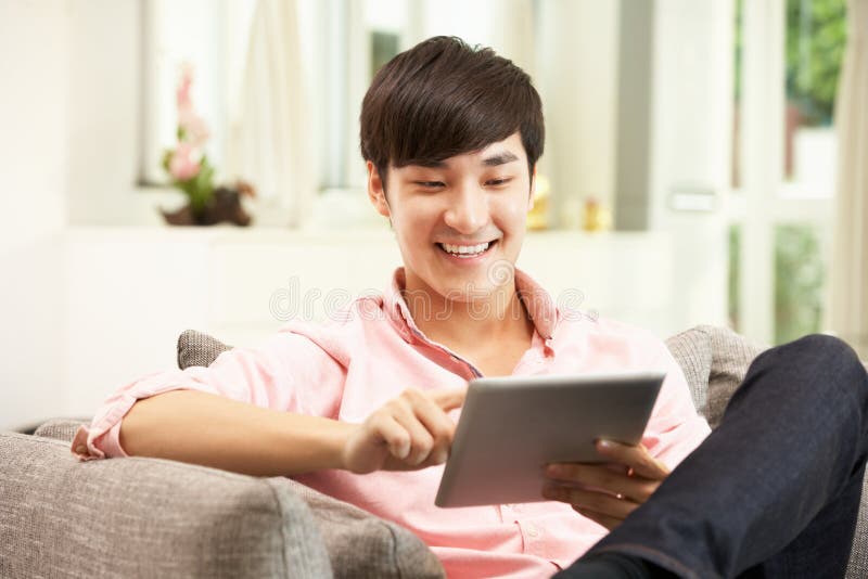 Young Chinese Man Using Digital Tablet Stock Photo - Image of kong ...