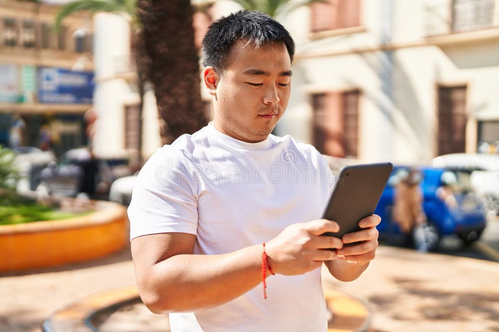 Young Chinese Man Using Touchpad at Park Stock Image - Image of asian ...