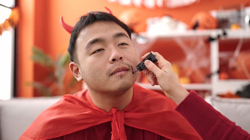 Young Chinese Man Wearing Devil Costume Make Up Blood on Face at Home ...