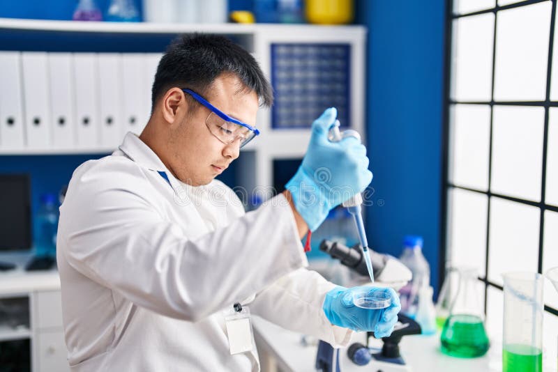 Young Chinese Man Wearing Scientist Uniform Working at Laboratory Stock ... Young Chinese Man Wearing Scientist Uniform Working at Laboratory Stock ...