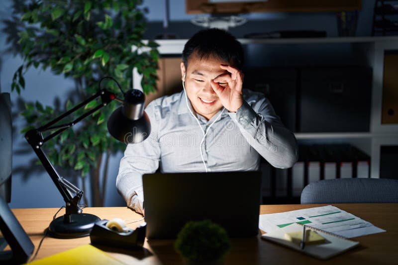Young Chinese Man Working Using Computer Laptop at Night Doing Ok ...