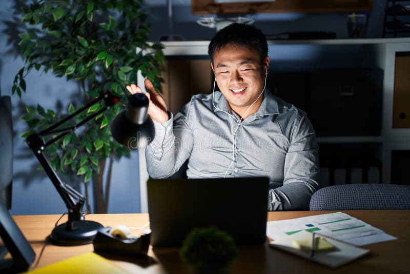 Young Chinese Man Working Using Computer Laptop at Night Smiling ...
