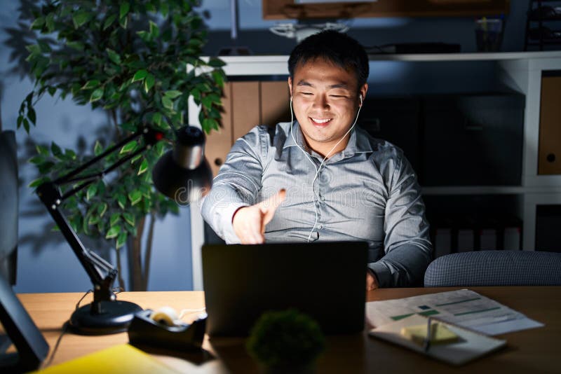 Young Chinese Man Working Using Computer Laptop at Night Smiling ...