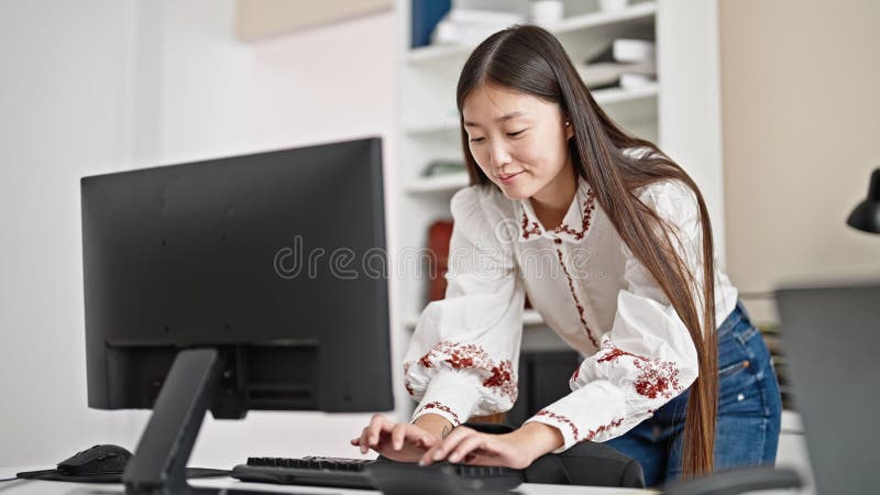 Young Chinese Woman Business Worker Using Computer Standing at Office ...
