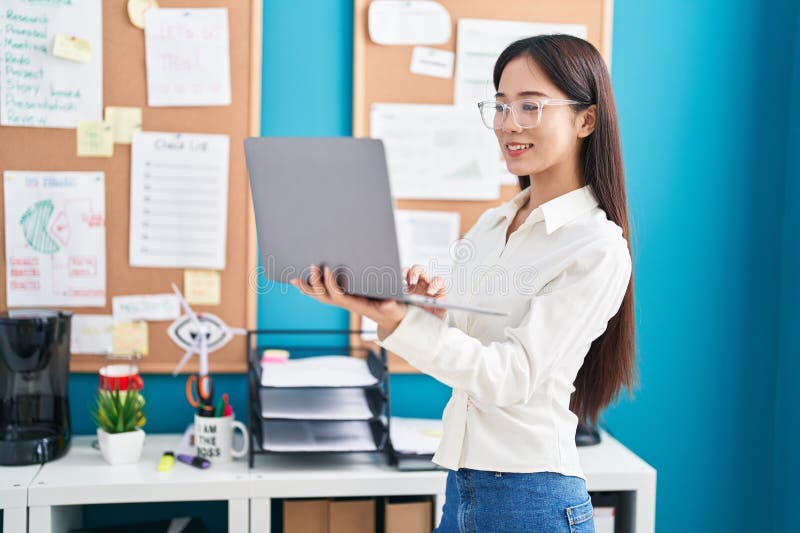 Young Chinese Woman Business Worker Using Laptop Working at Office ...
