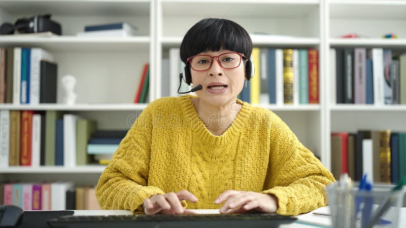 Young Chinese Woman Call Center Agent Working at Library University ...