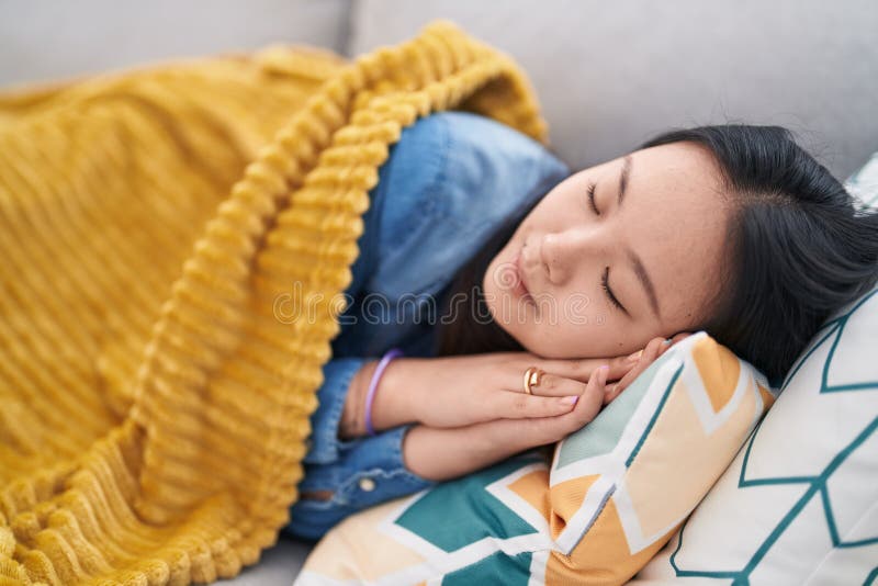 Young Chinese Woman Lying on Sofa Sleeping at Home Stock Image - Image ...