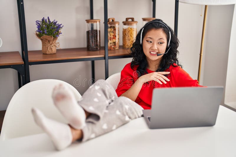Young Chinese Woman Operator Having Video Call at Home Stock Photo ...