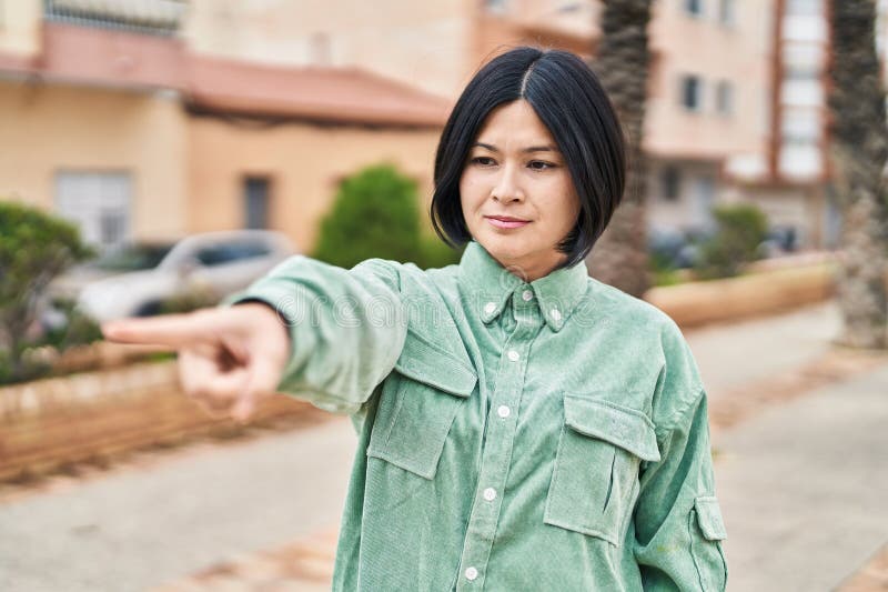 Young Chinese Woman Pointing with Finger at Park Stock Photo - Image of ...