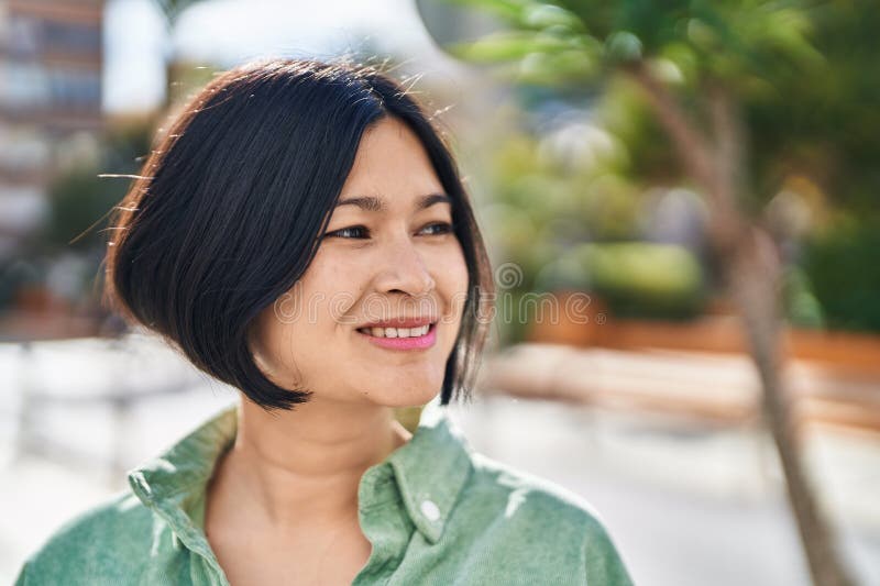 Young Chinese Woman Smiling Confident Standing at Park Stock Photo ... Young Chinese Woman Smiling Confident Standing at Park Stock Photo ...