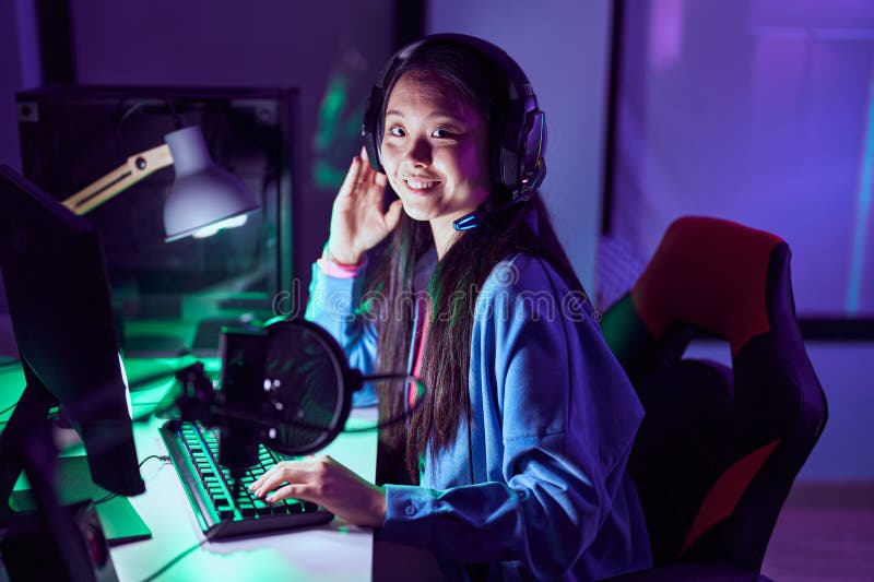 Young Chinese Woman Streamer Using Computer with Winner Expression at ...