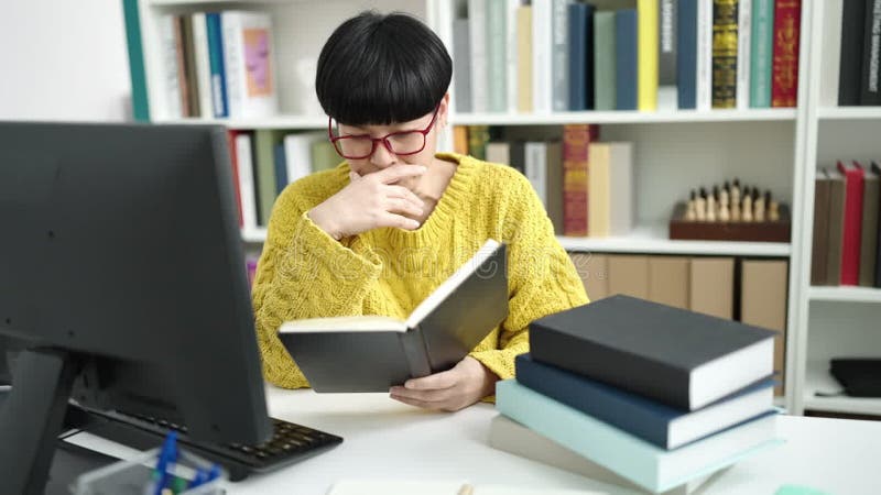 Young Chinese Woman Student Reading Book Studying at Library University ...