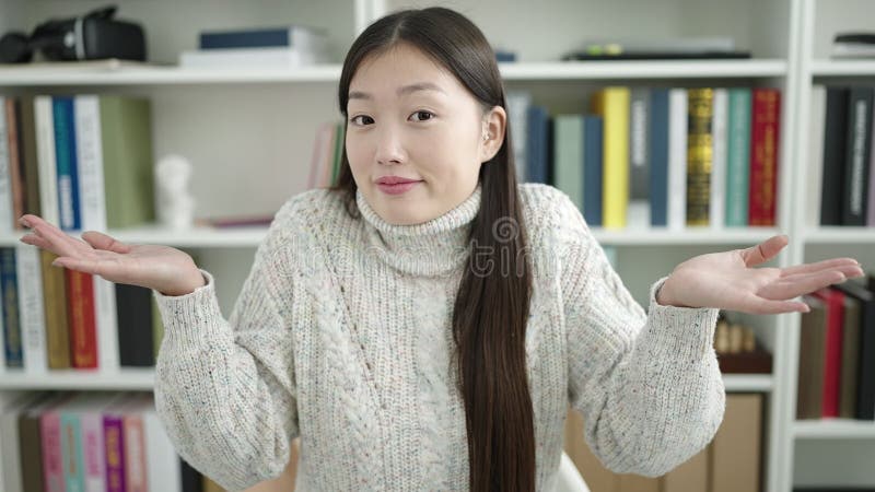 Young Chinese Woman Student Standing with I Dont Know Expression at ...
