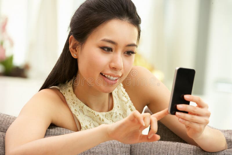 Young Chinese Woman Using Mobile Phone at Home Stock Image - Image of ...
