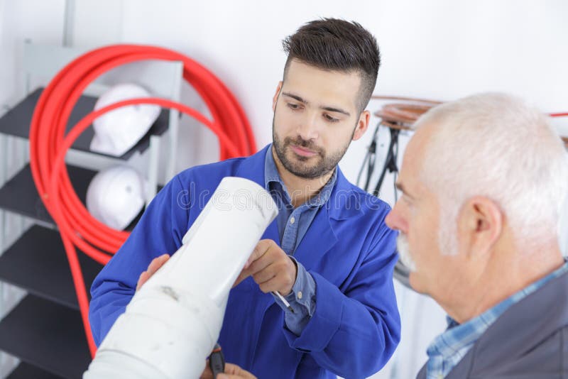 Young Civil Engineer with Master during Training Stock Photo - Image of ...