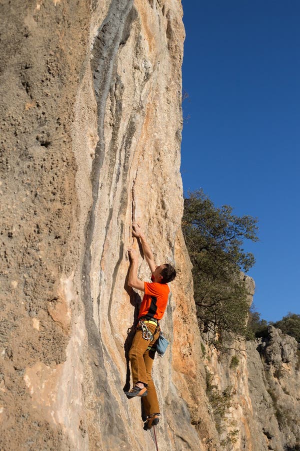 Young Climber Hanging by a Cliff Stock Image - Image of forest, courage ...