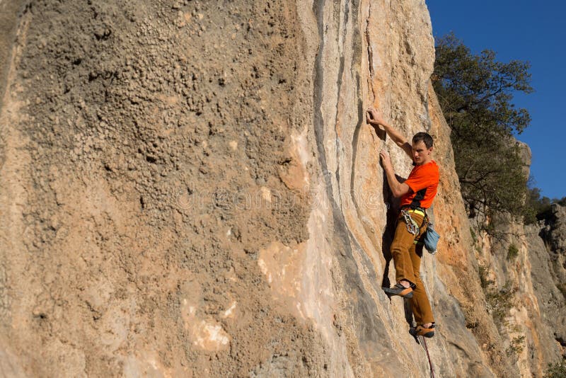 Young Climber Hanging by a Cliff Stock Image - Image of forest, courage ...
