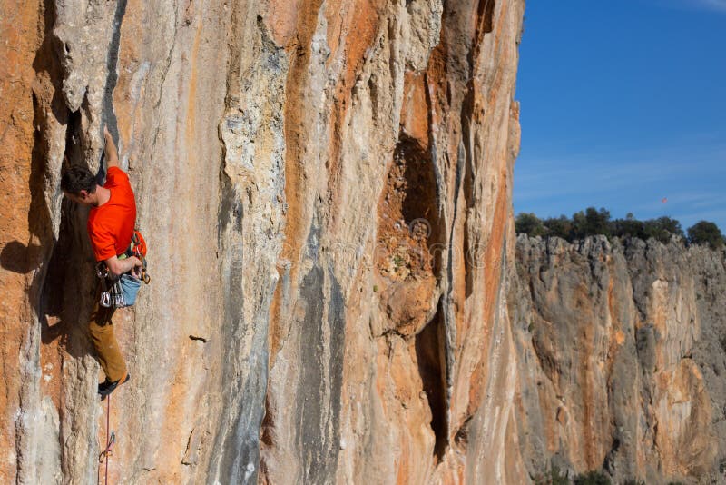 Young Climber Hanging by a Cliff. Stock Image - Image of athletic ...