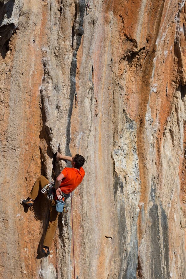 Young Climber Hanging by a Cliff. Stock Photo - Image of adventure ...