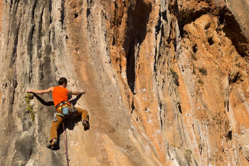 Young Climber Hanging by a Cliff. Stock Photo - Image of alone, explore ...