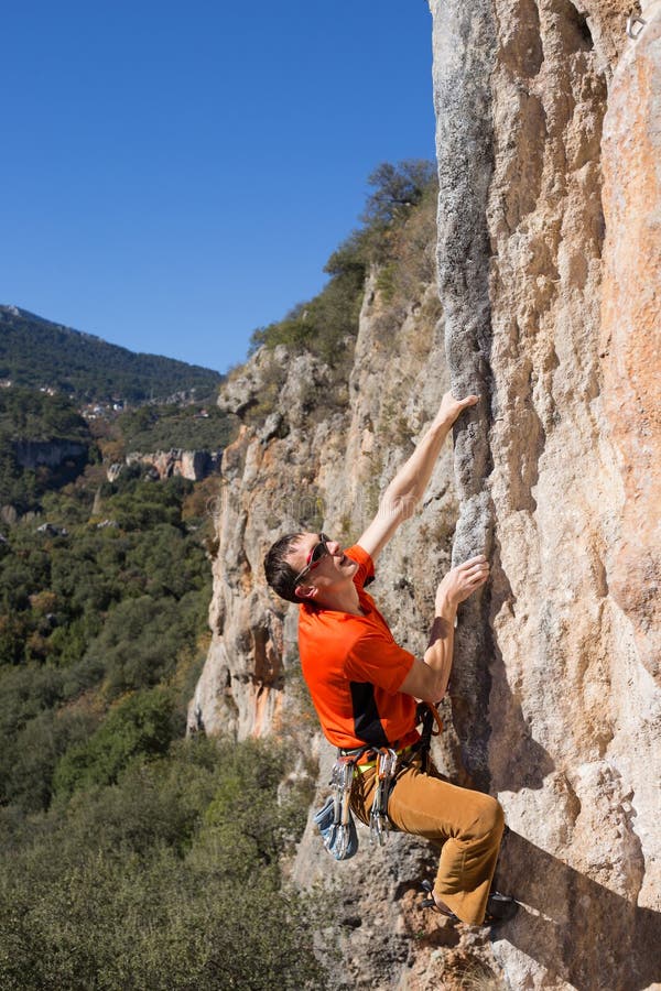 Young Climber Hanging by a Cliff. Stock Photo - Image of effort ...