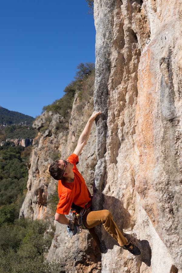 Young Climber Hanging by a Cliff Stock Image - Image of forest, courage ...