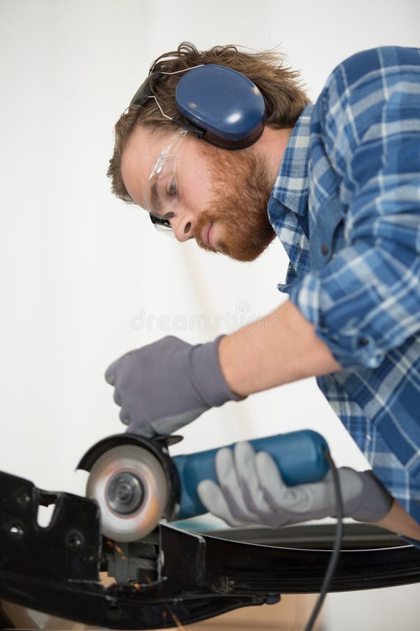 Young Coachbuilder Mechanic Using Grinder Stock Photo - Image of ...