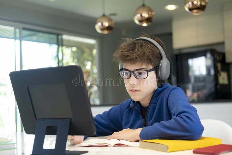 Young Collage Student Using Computer and Mobile Device Studying Online ...