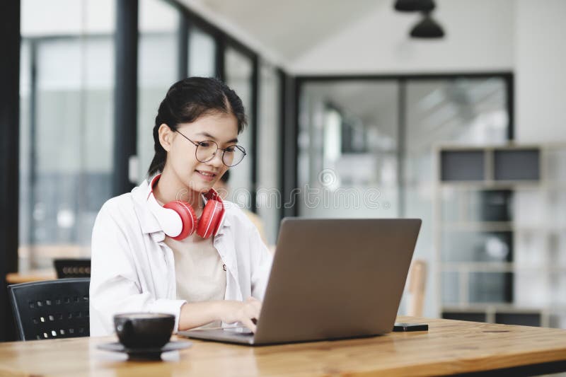 Young Collage Student Using Computer and Mobile Device Studying Online ...