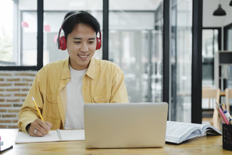 Young Collage Student Using Computer and Mobile Device Studying Online ...