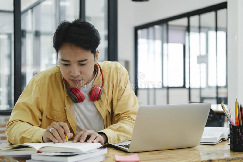 Young Collage Student Using Computer and Mobile Device Studying Online ...