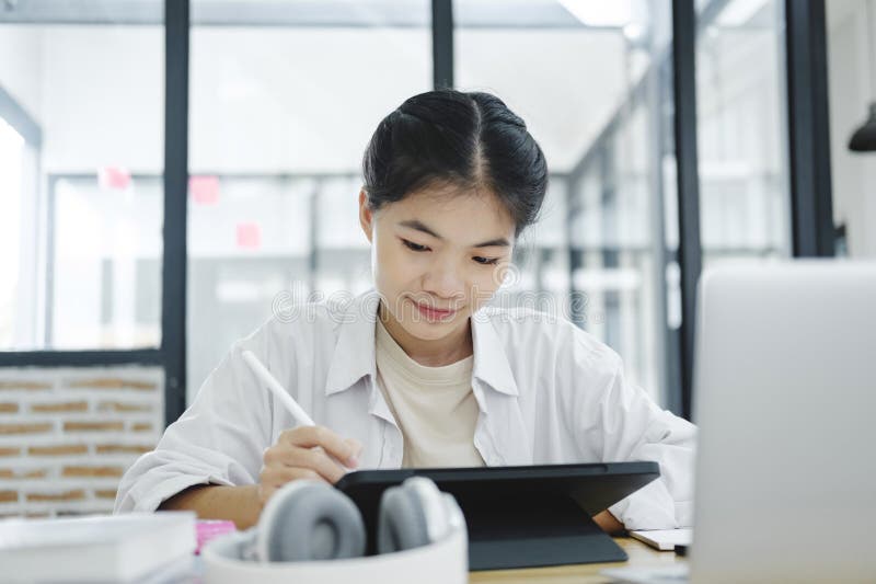 Young Collage Student Using Computer and Mobile Device Studying Online ...
