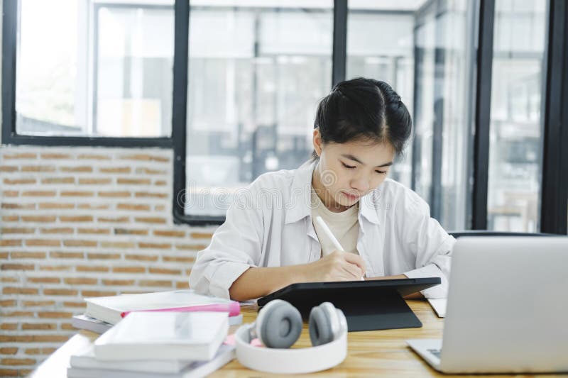 Young Collage Student Using Computer and Mobile Device Studying Online ...